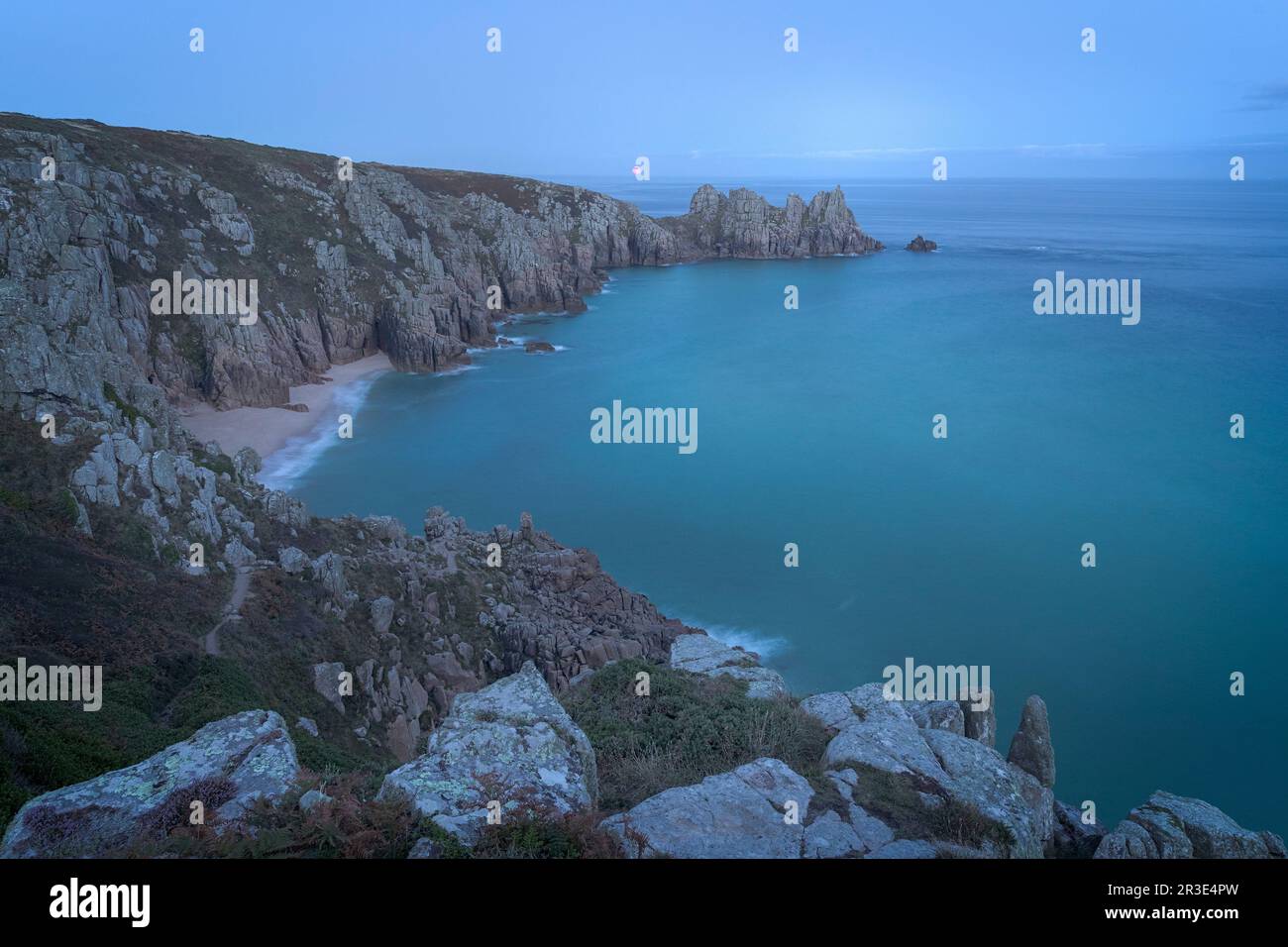 Moonrise behind Logans Rock, Cornwall Stock Photo - Alamy