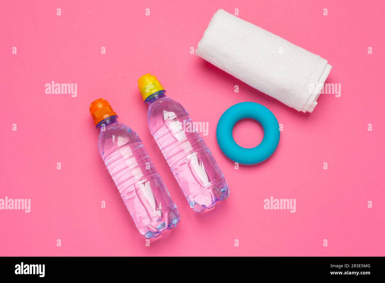 Water bottle flat lay top view on color paper background Stock Photo ...