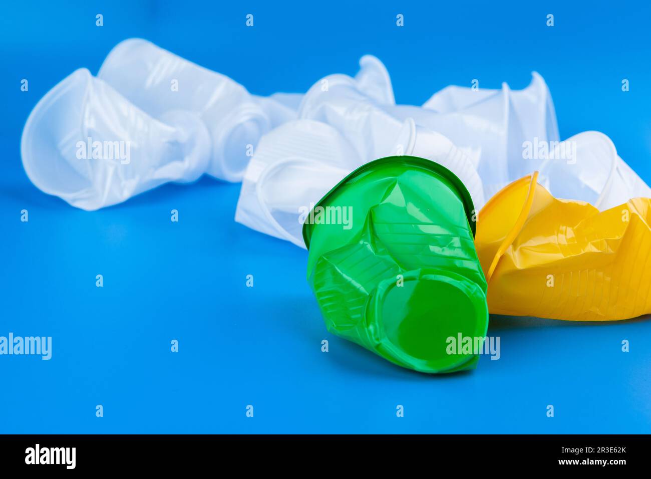 Disposable colored plastic cups garbage. Garbage and pollution concept ... Disposable colored plastic cups garbage. Garbage and pollution concept ...