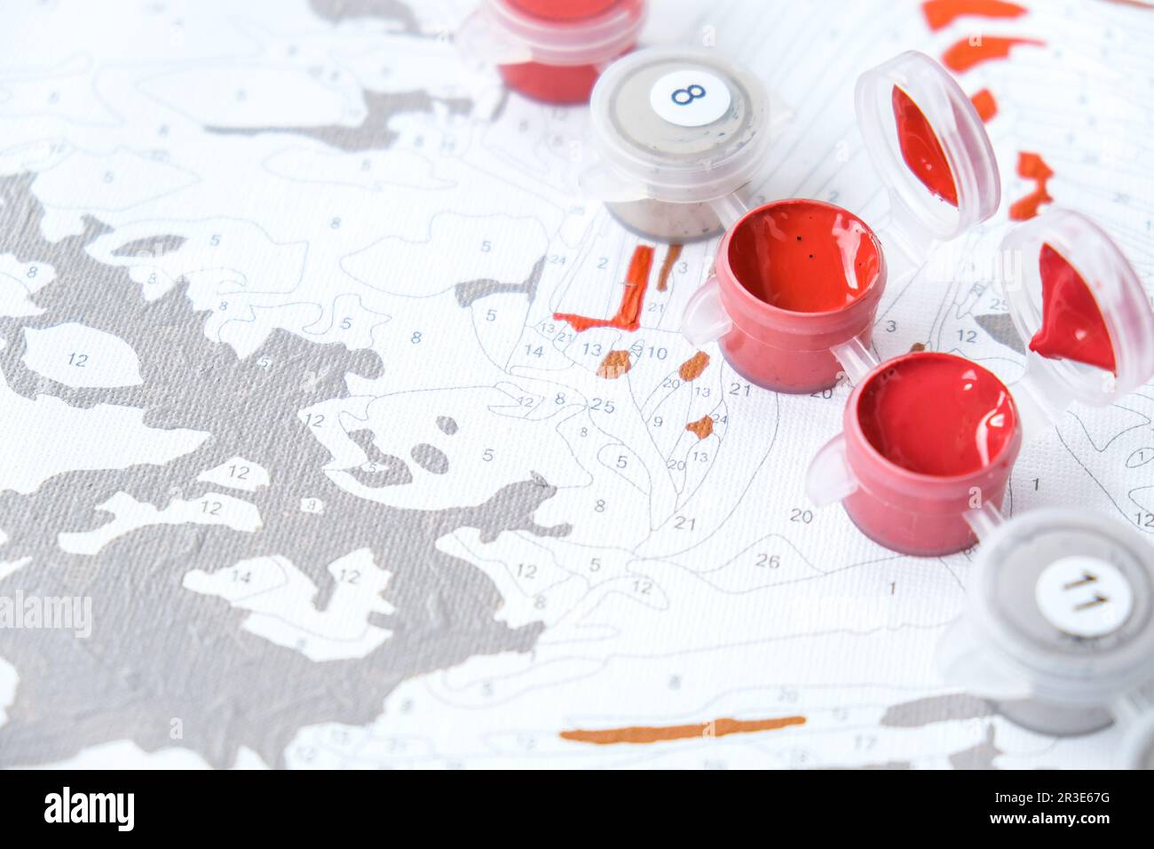 Acrylic paints on numbered canvas. Picture by numbers. Creative hobby ...