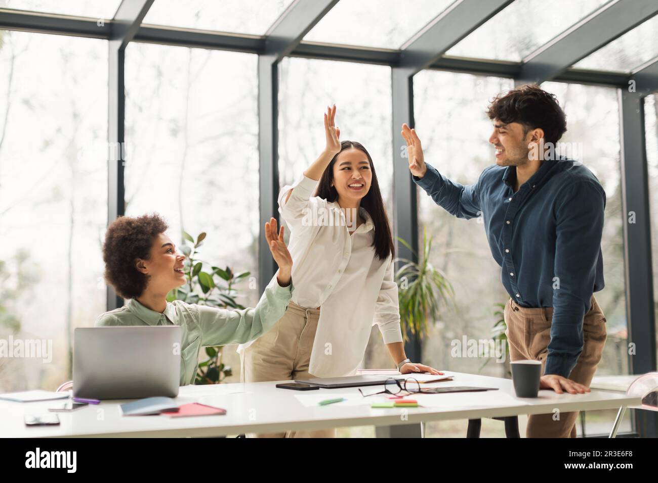 United Business Team Giving High Five Celebrating Success In Office ...