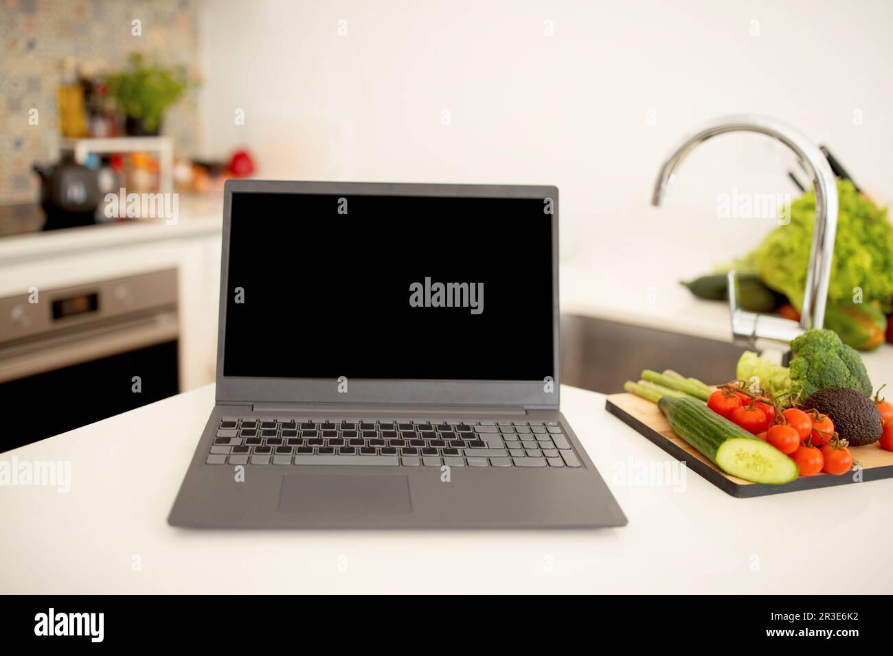 Laptop Computer With Empty Screen Standing On Kitchen Countertop Indoor ...