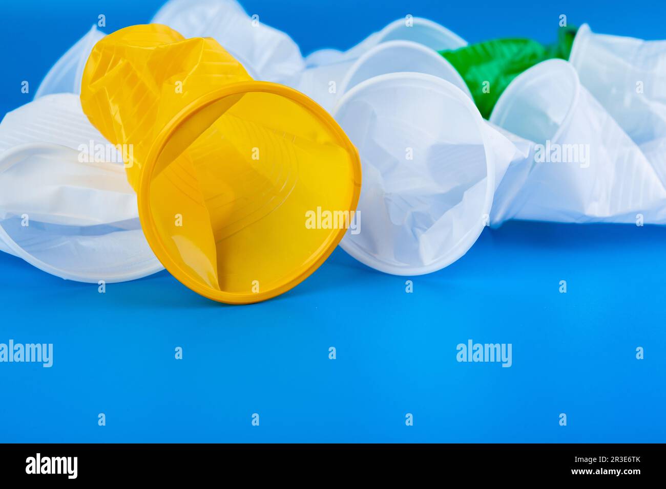 Disposable colored plastic cups garbage. Garbage and pollution concept ...