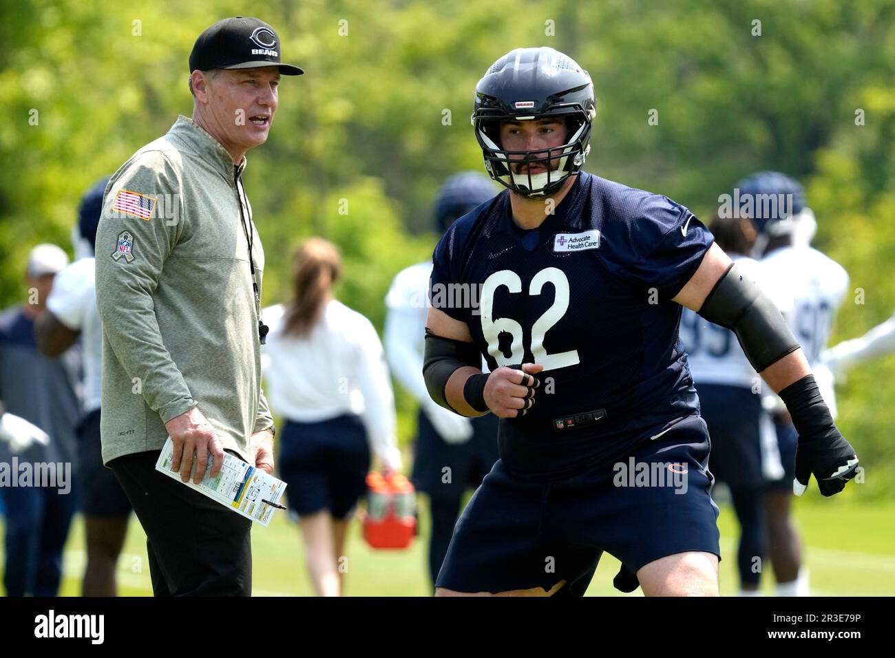 Chicago Bears head coach Matt Eberflus, left, talks to offensive ...