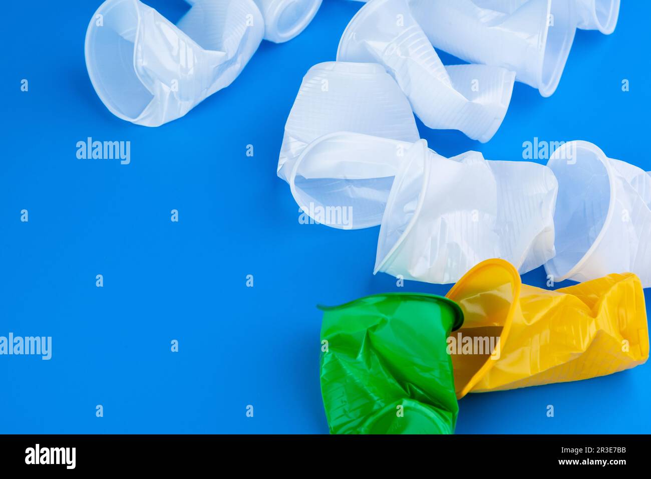 Disposable colored plastic cups garbage. Garbage and pollution concept ...