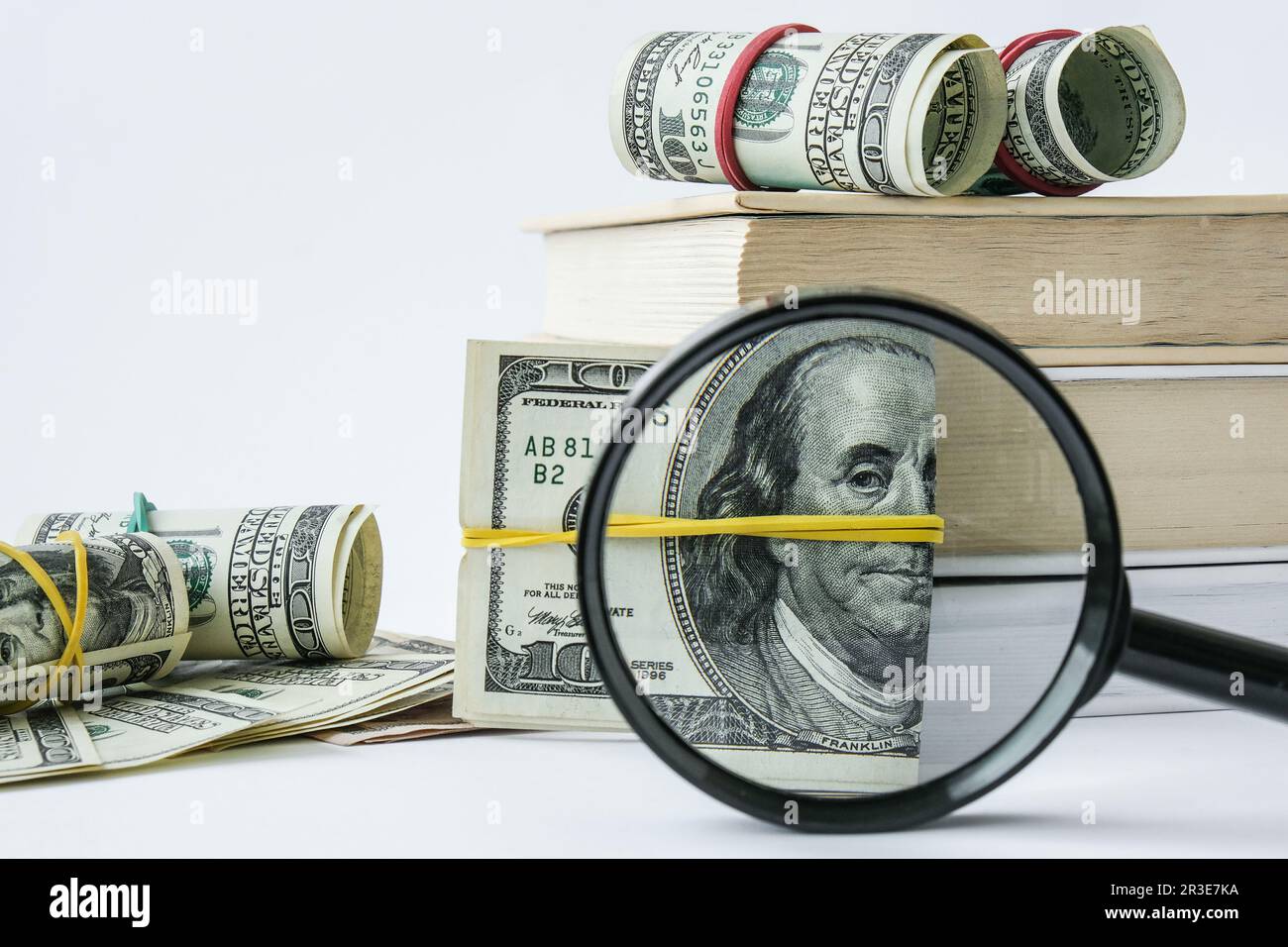 Knowledge leads to wealth. Stack of books with dollars. Concept of ...