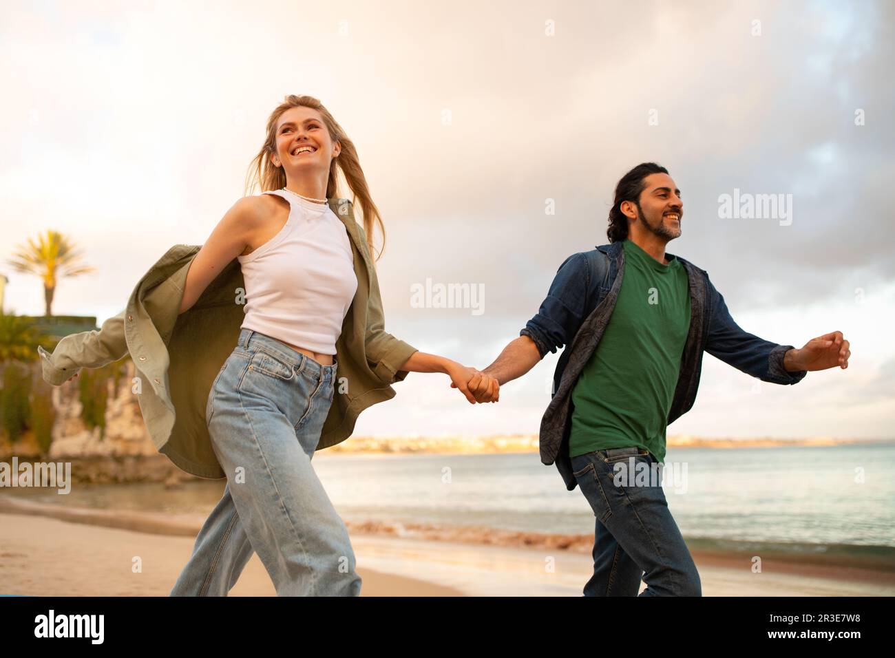 Romantic lovers running on beach hi-res stock photography and images ...