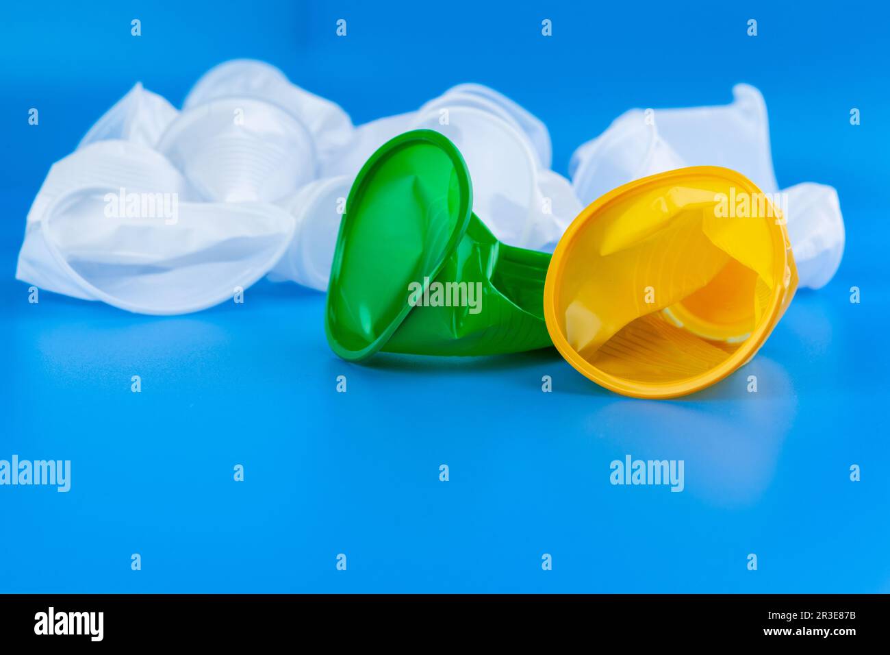 Disposable colored plastic cups garbage. Garbage and pollution concept ...