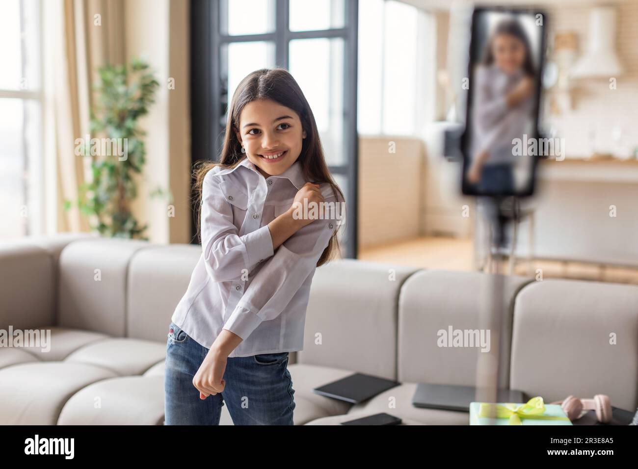 Happy Blogger Girl Filming Her Dance Via Smartphone At Home Stock Photo ...