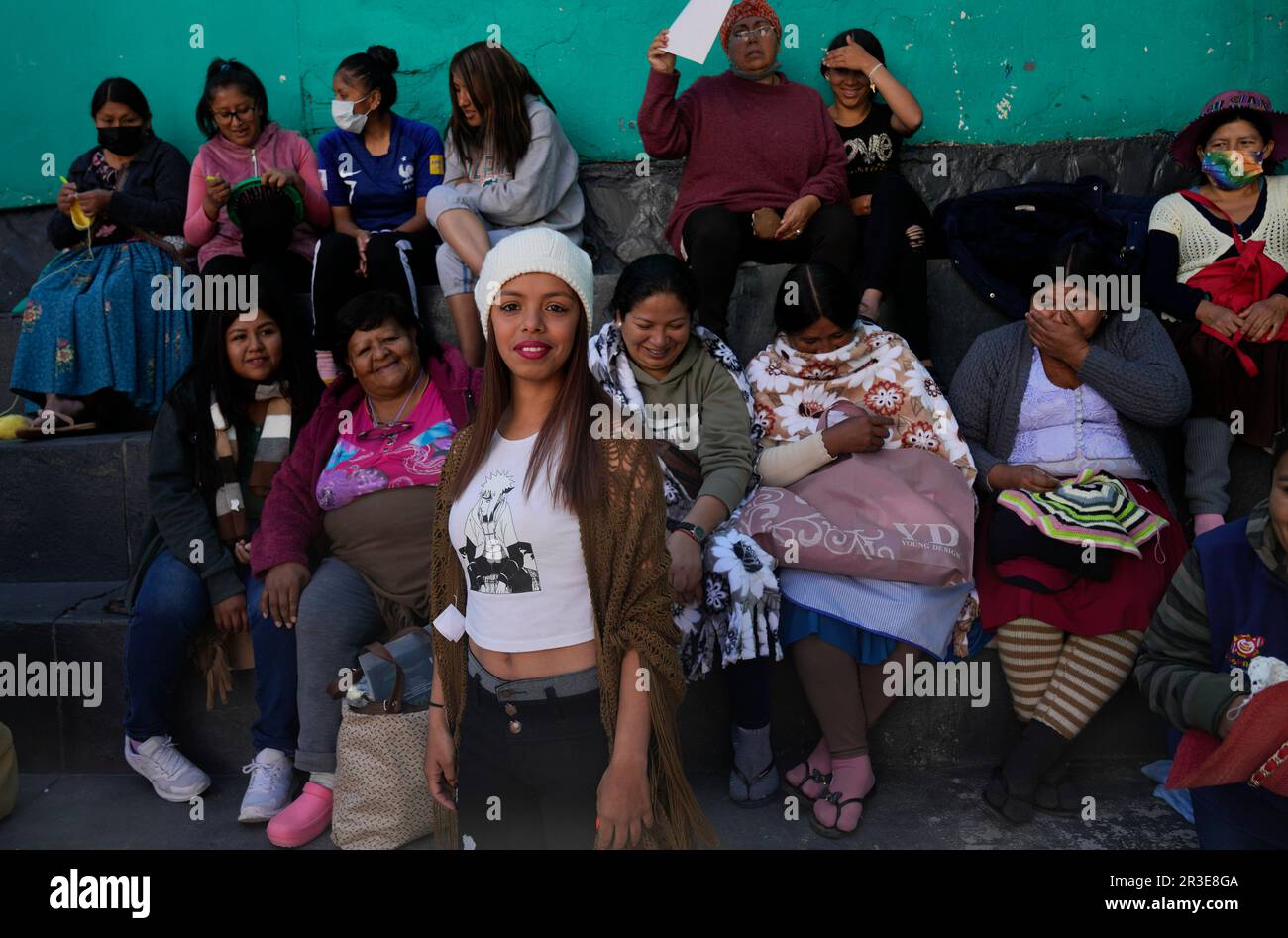 An inmate smiles as she models a creation made by a fellow inmate at a ...