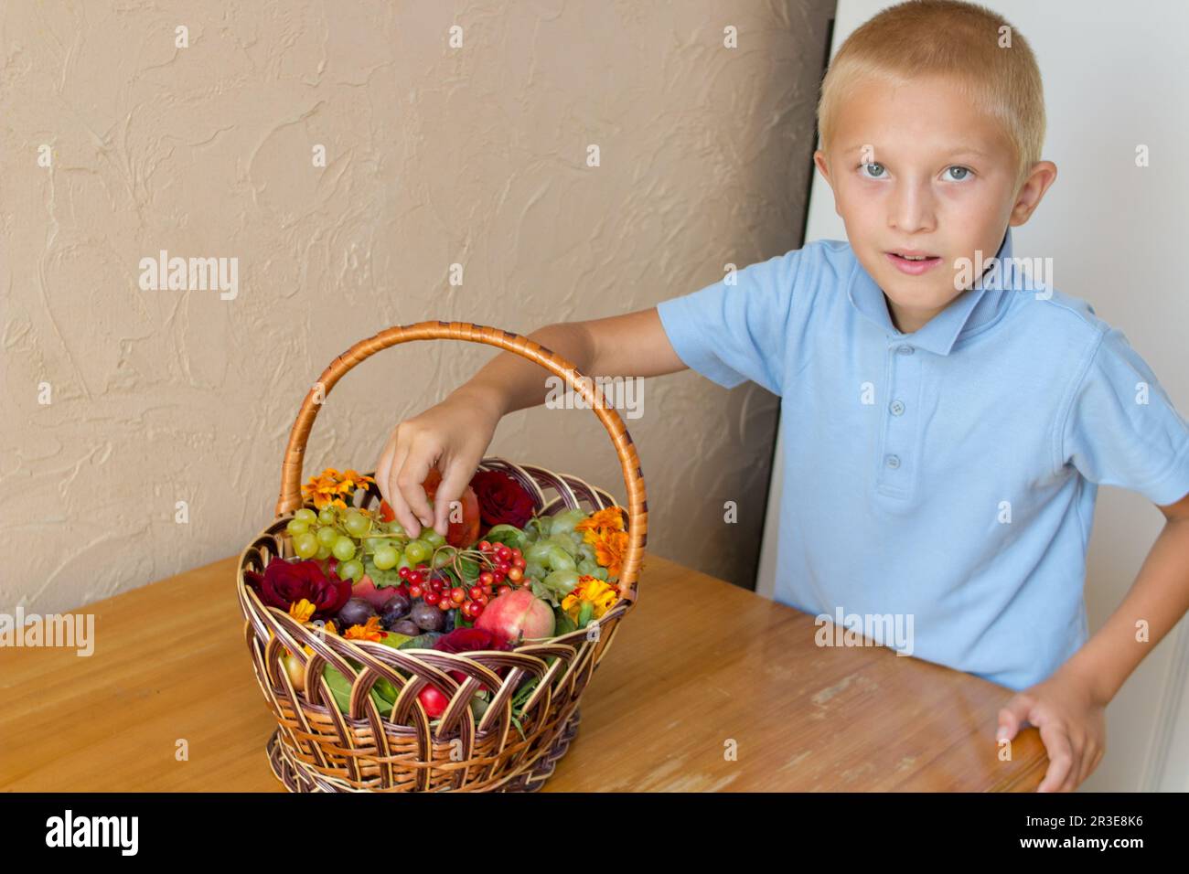 Little boy with basket of fruits, isolated on white Stock Photo - Alamy