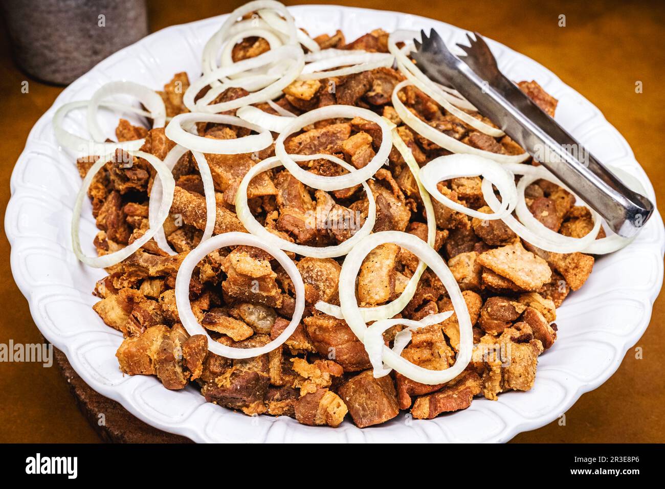 brazilian pork rinds, served buffet style, with onions and other ...