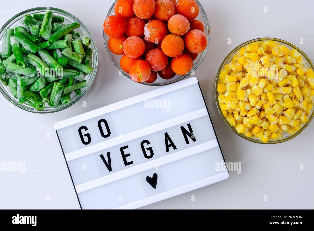 Lightbox with text GO VEGAN Three Bowls of frozen vegetables food of ...