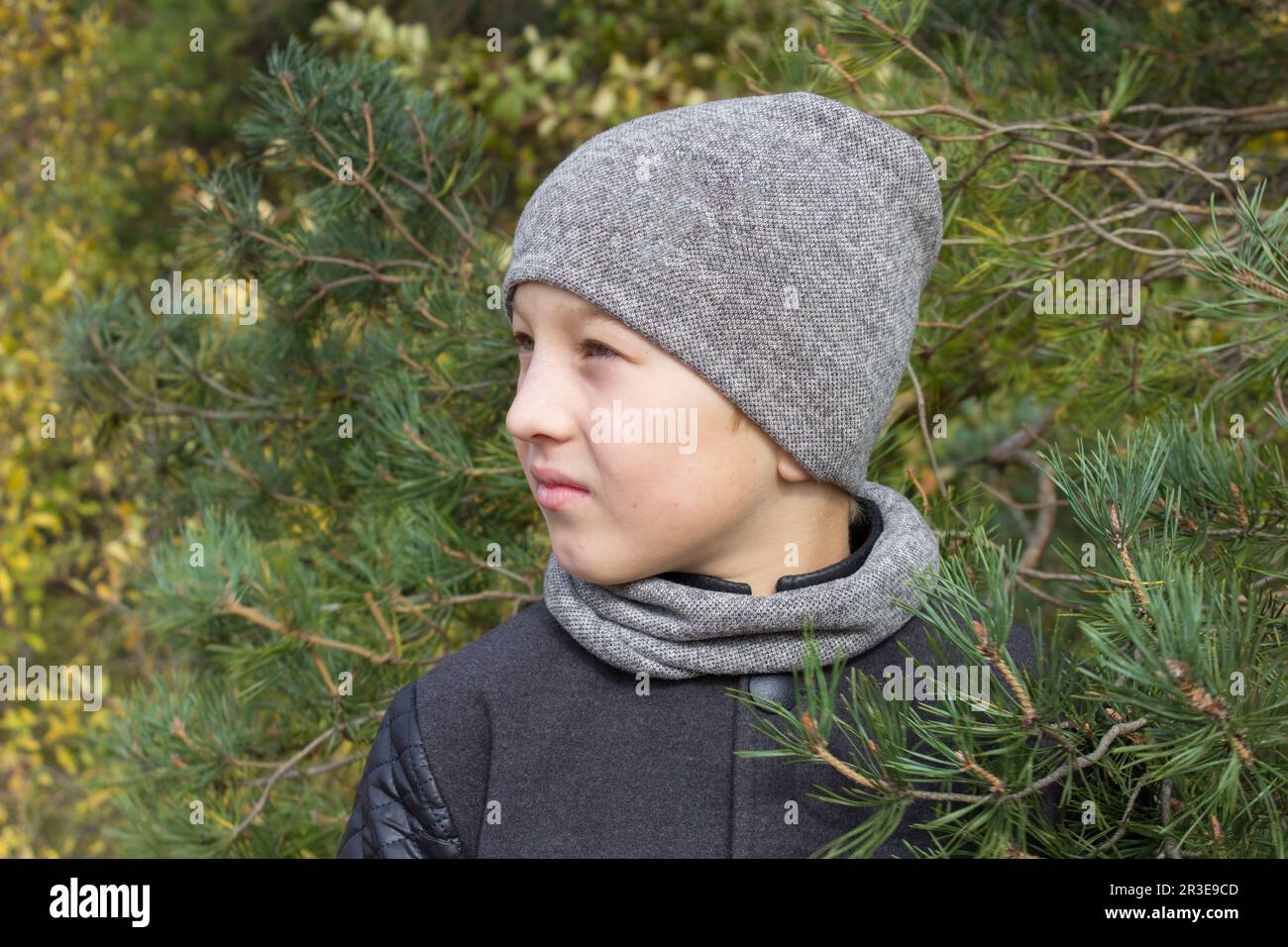the boy turned his head to the side of the forest in close-up Stock ...
