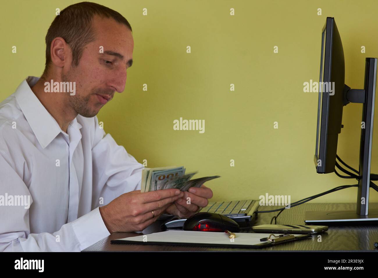 Computer money holding office hi-res stock photography and images - Alamy