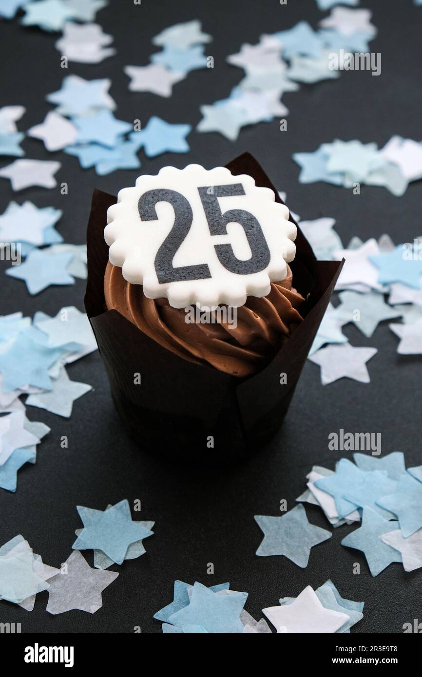 Number 25 on Delicious chocolate cupcake with cream on dark background ...