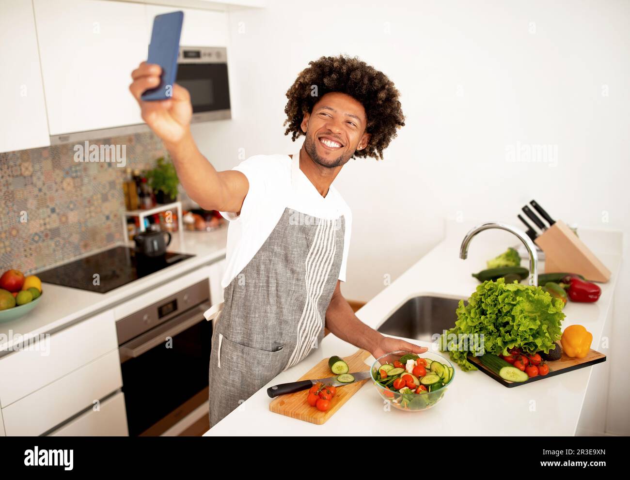 African American Guy Making Selfie Via Phone While Cooking Indoor Stock ...