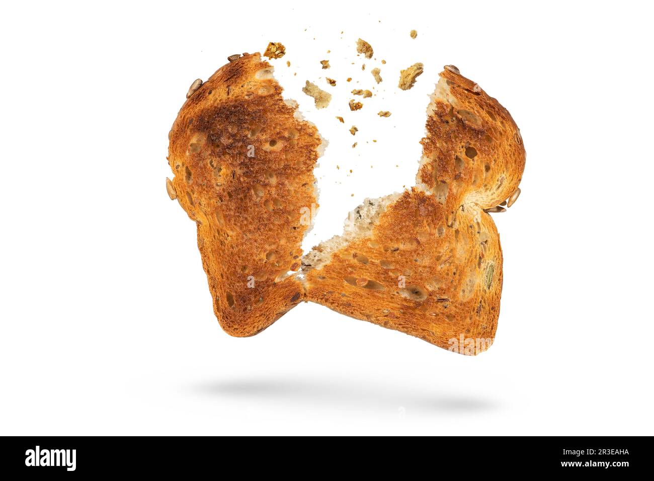 White bread slice isolate broken into 2 pieces with flying crumbs ...