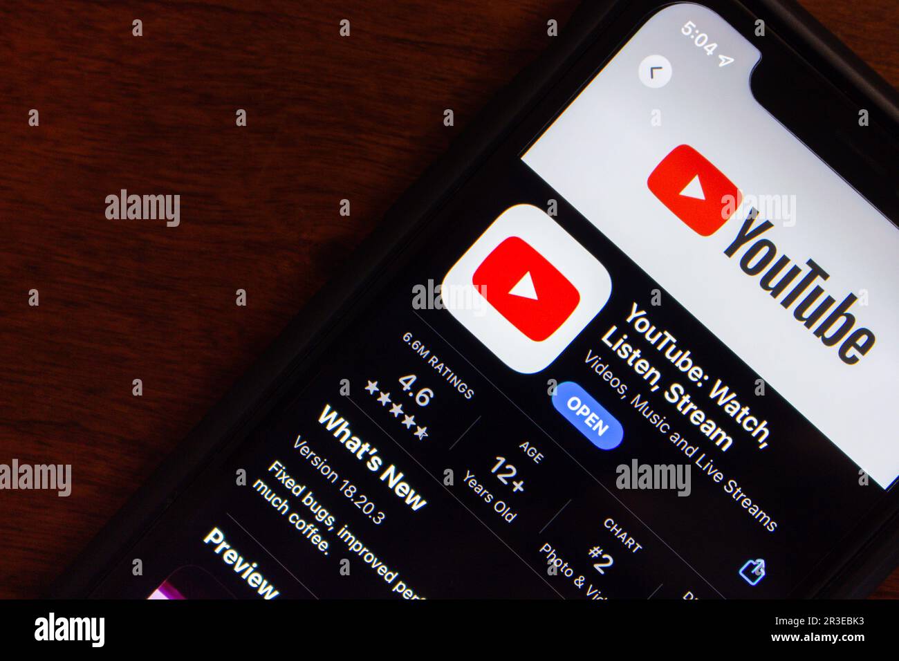 YouTube app icon seen in an App Store on an iPhone screen. YouTube is ...