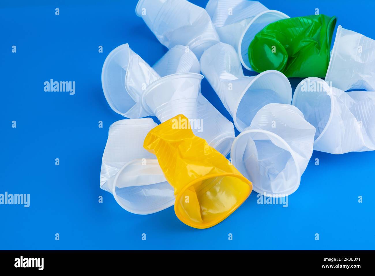 Disposable colored plastic cups garbage. Garbage and pollution concept ...