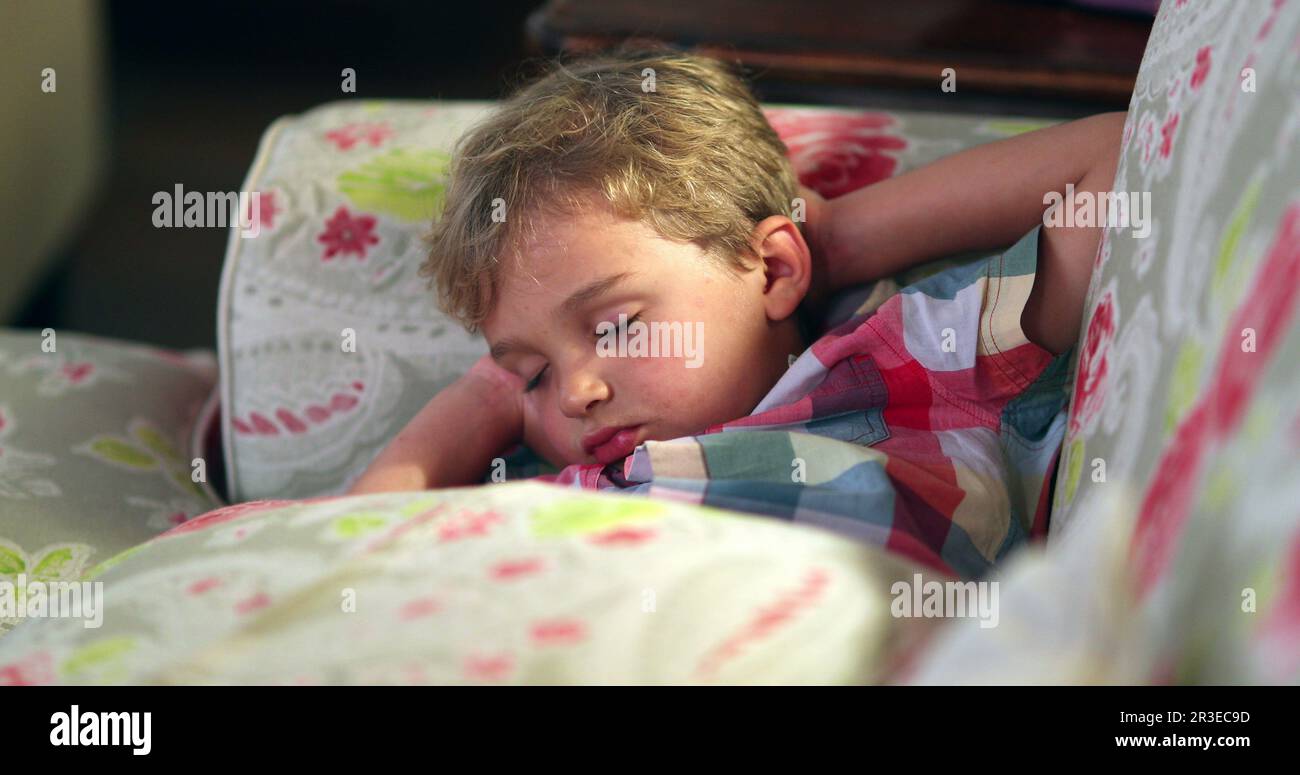 Slouched on sofa hi-res stock photography and images - Alamy