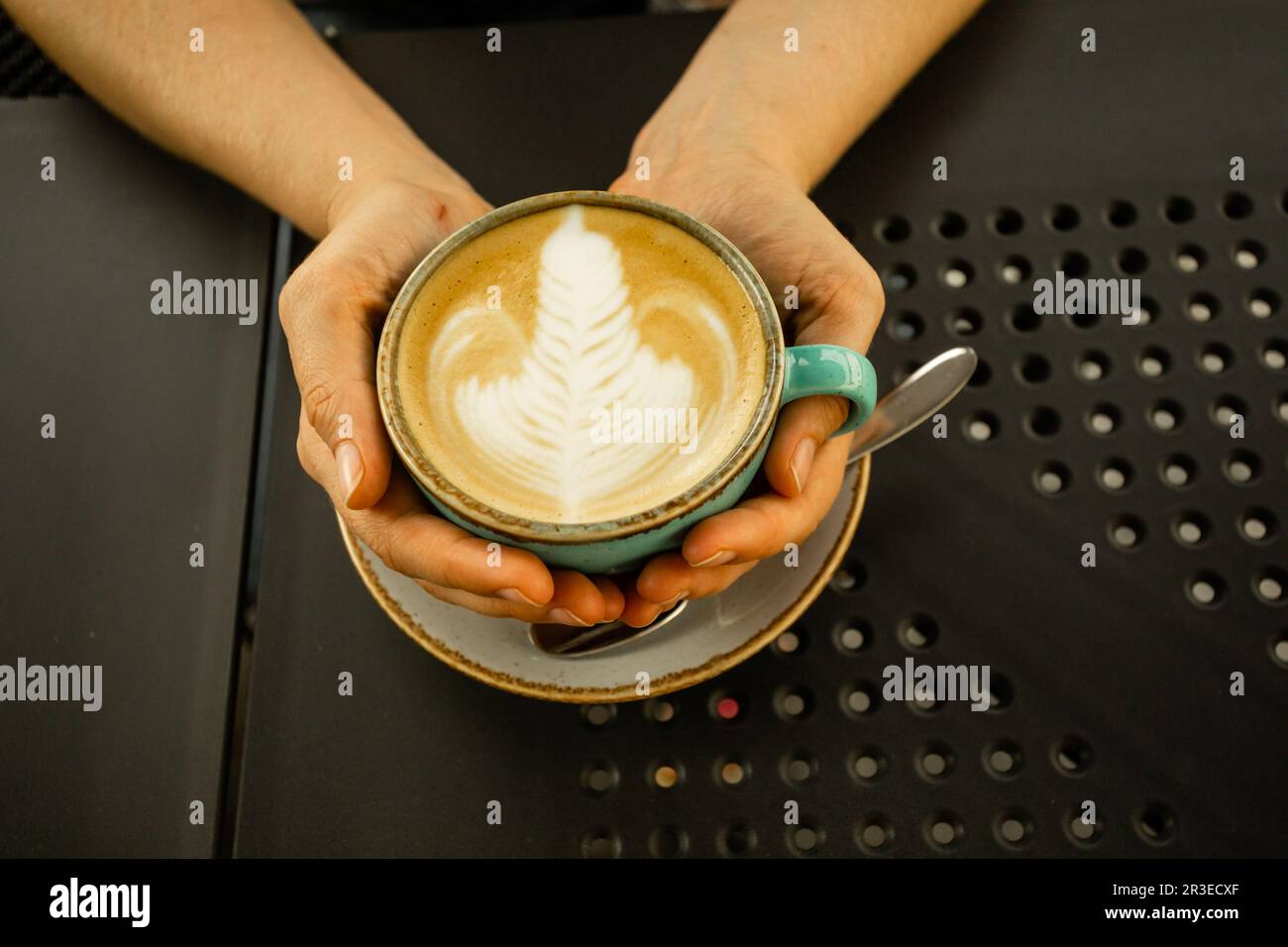 Woman holding cup in hands hi-res stock photography and images - Alamy