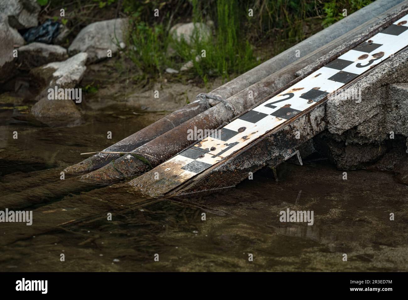 Scale at shore of river to measure water level, which is very low on ...