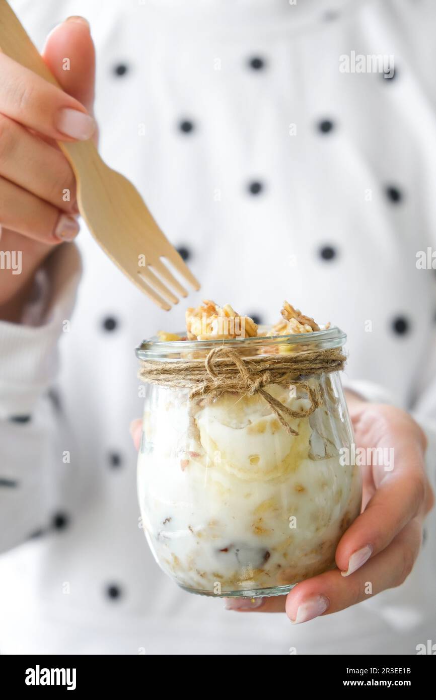 Female hands, woman eating Healthy breakfast. Oatmeal Granola with ...