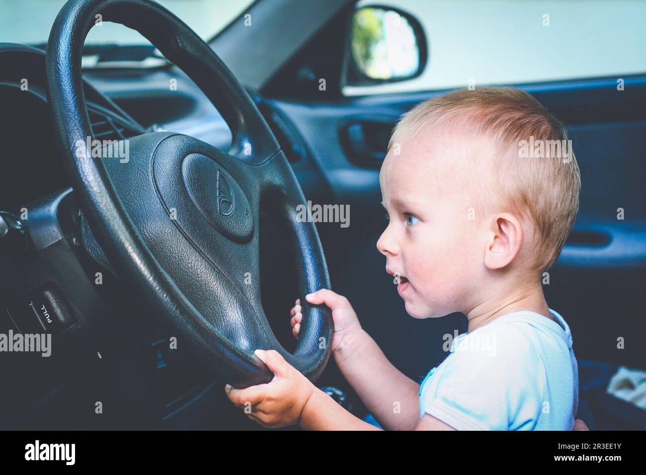 Little baby boy driver Stock Photo - Alamy