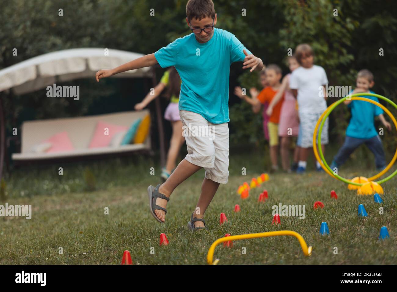 The children actively spend time in the garden Stock Photo - Alamy