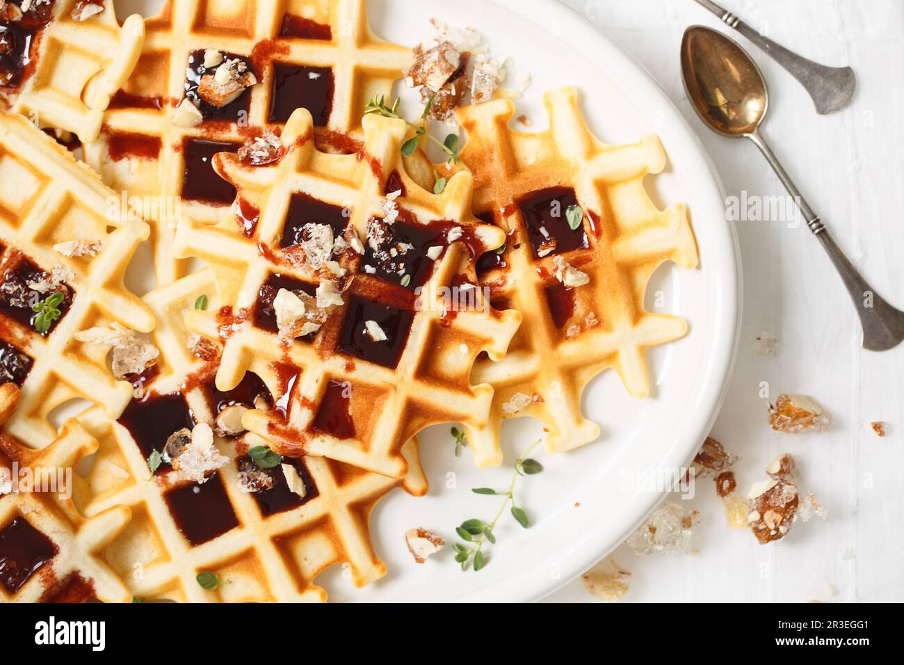 Belgian or Brussels waffles with date syrup or jam and candied roasted ...