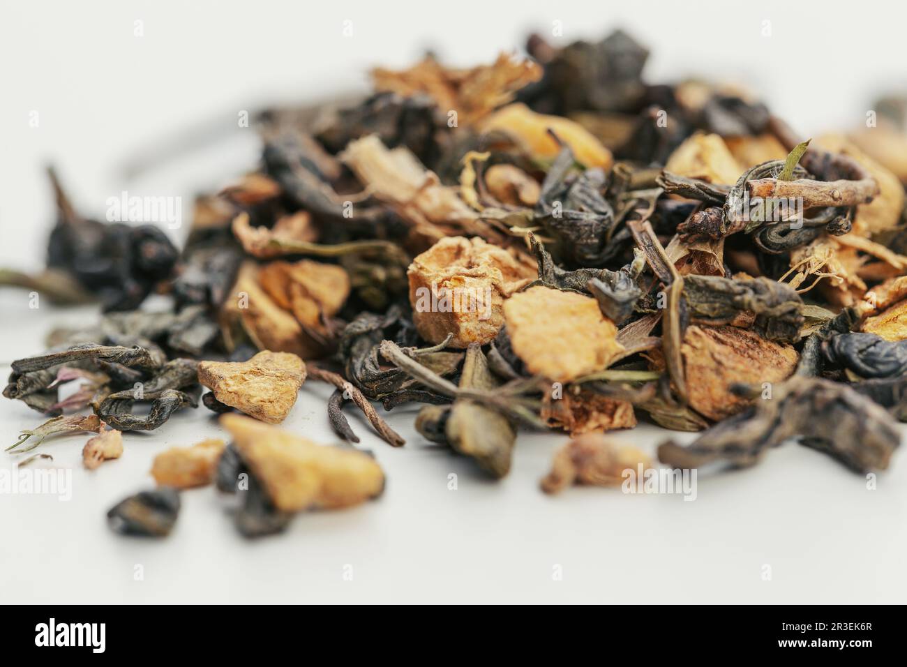 Dried tea leaves close up on white background Stock Photo - Alamy