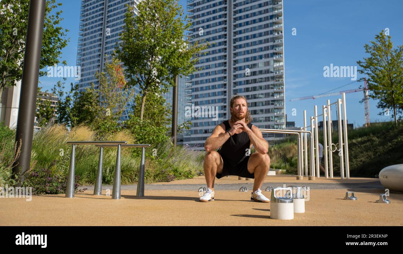 Focused millennial man doing morning sports to keep fit. Athletic man ...