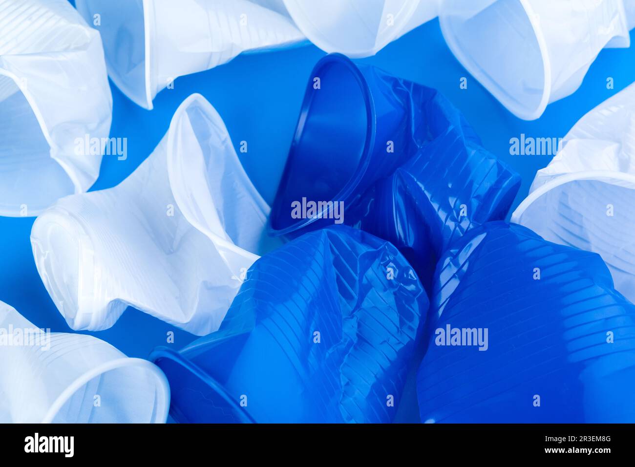 Disposable colored plastic cups garbage. Garbage and pollution concept ...