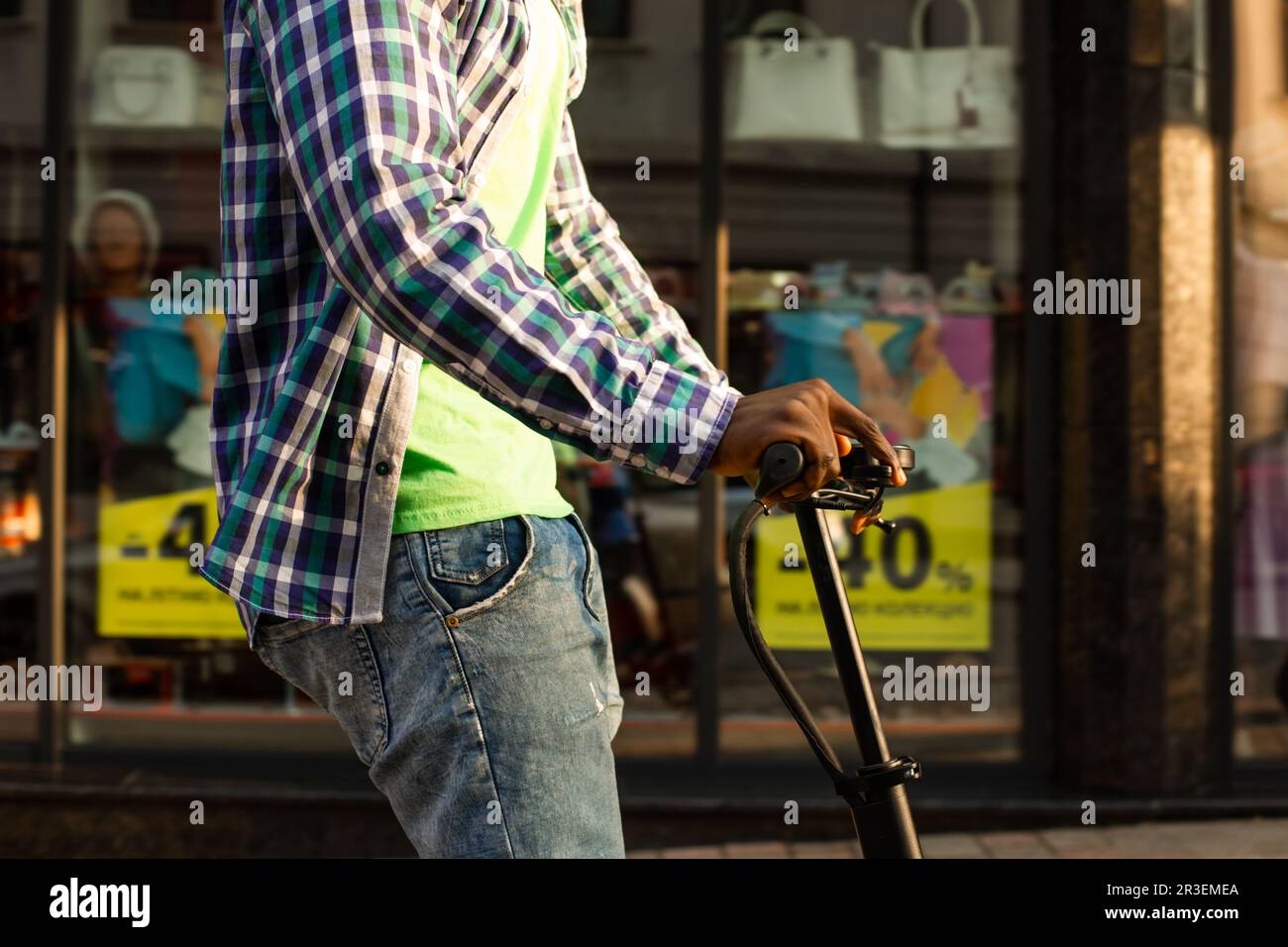 The man deftly rides an electric scooter Stock Photo - Alamy