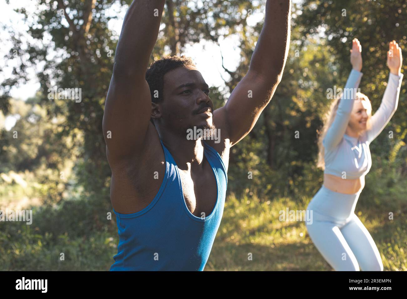 The young diverse people practice yoga in nature Stock Photo - Alamy