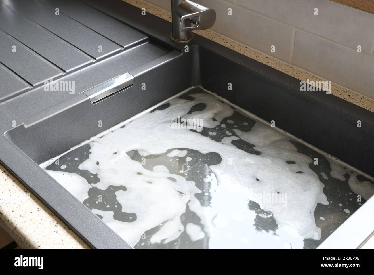Overflowing kitchen sink, clogged drain, plumbing problems, trying to ... Overflowing kitchen sink, clogged drain, plumbing problems, trying to ...