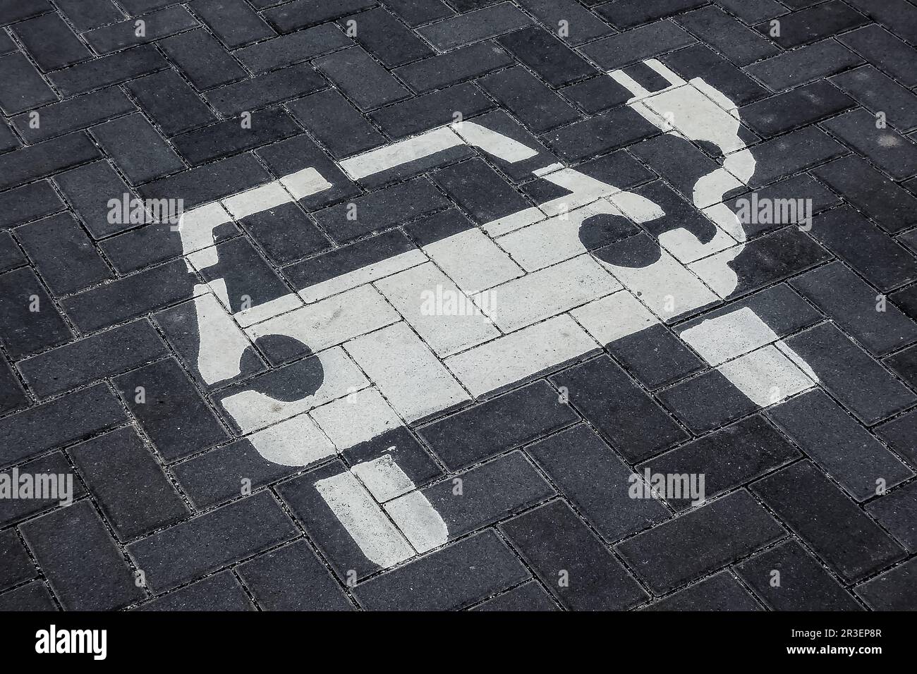 An electric car at a charging station is being charged - symbol sign ...