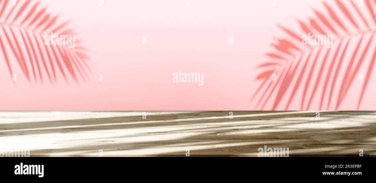 Table shadow background. Wooden table and white empty wall with plant ...