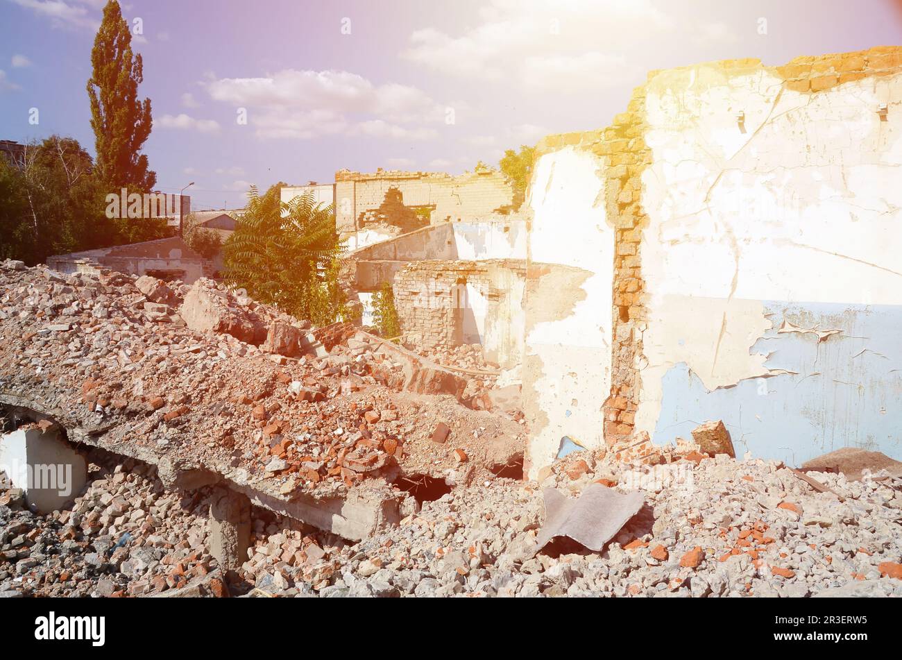 Collapsed industrial multistorey building in daytime. Disaster scene ...