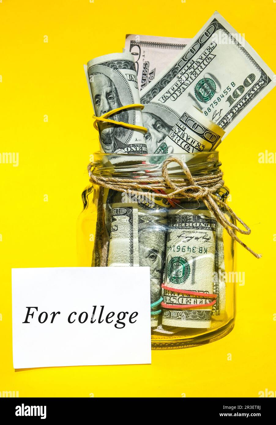 Dollars cash money in rubber band with text written note FOR COLLEGE ...