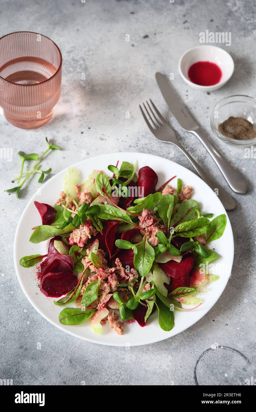 Healthy fresh salad. Beetroot, red chard and canned tuna salad. Healthy ...
