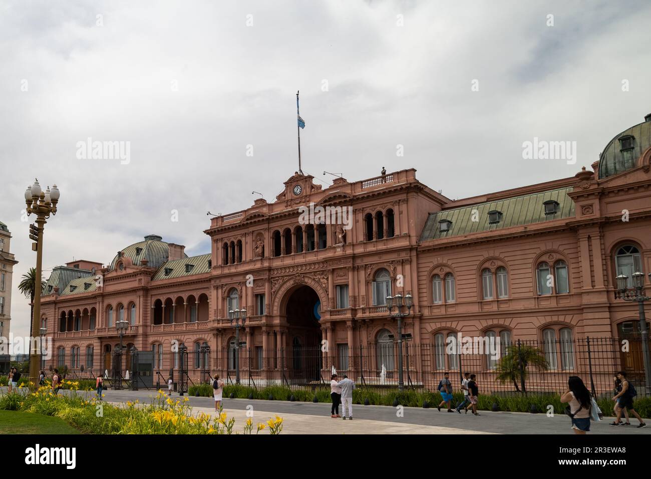 Passersby in Front of the Iconic Pink House Facade Stock Photo - Alamy