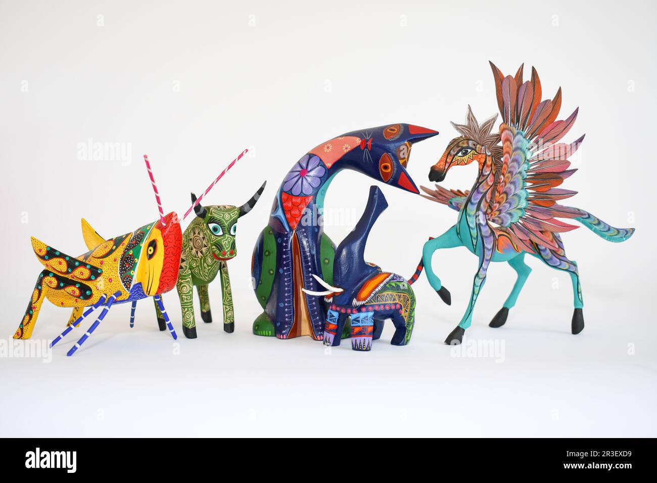 Colorful alebrijes of different animals. Mexican hand-painted wooden ...