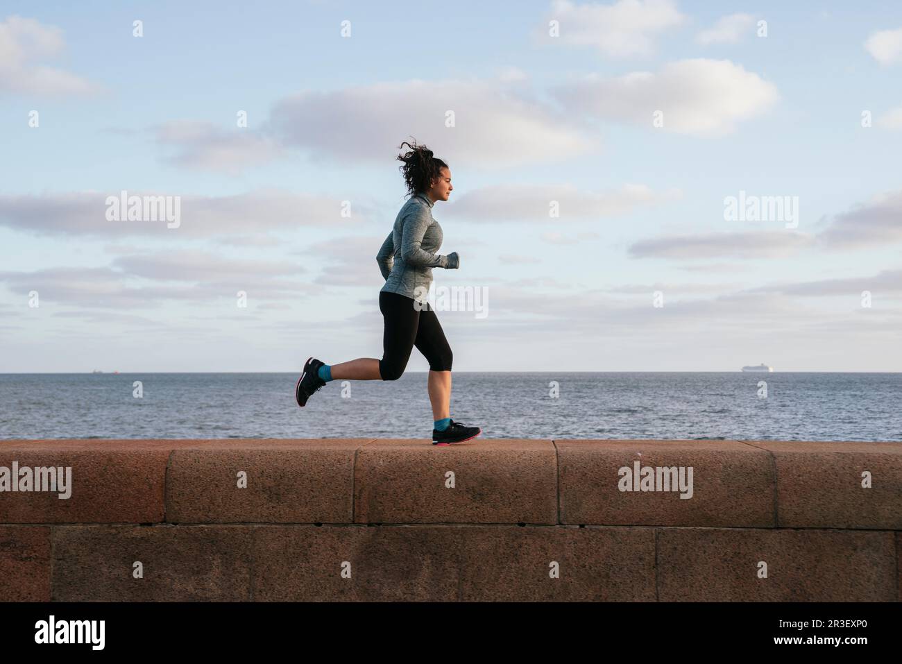 girl running to the right Stock Photo - Alamy