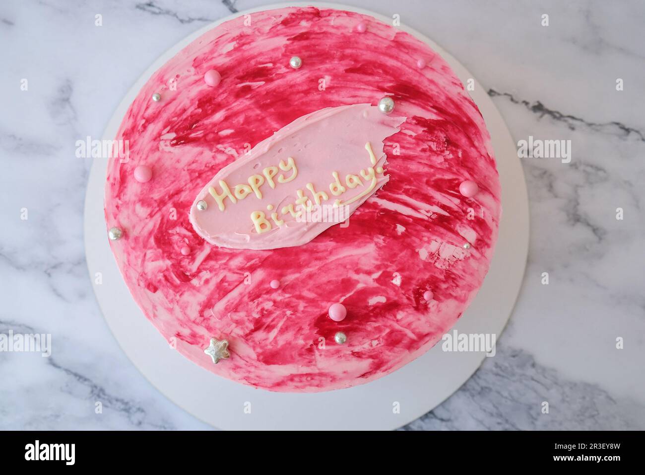 HAPPY BIRTHDAY text on pink cake. Celebration party concept. Modern ...