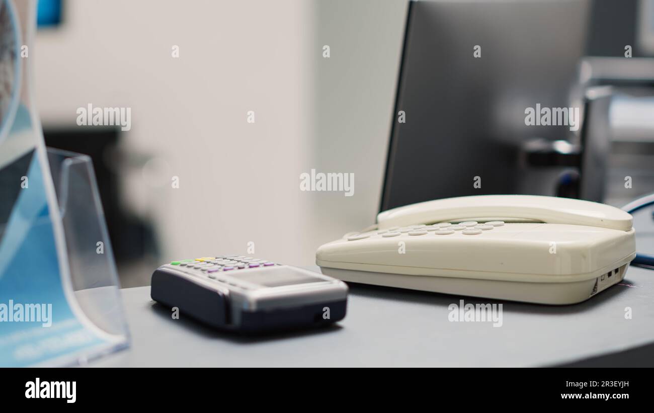 Empty front desk with landline phone Stock Photo - Alamy