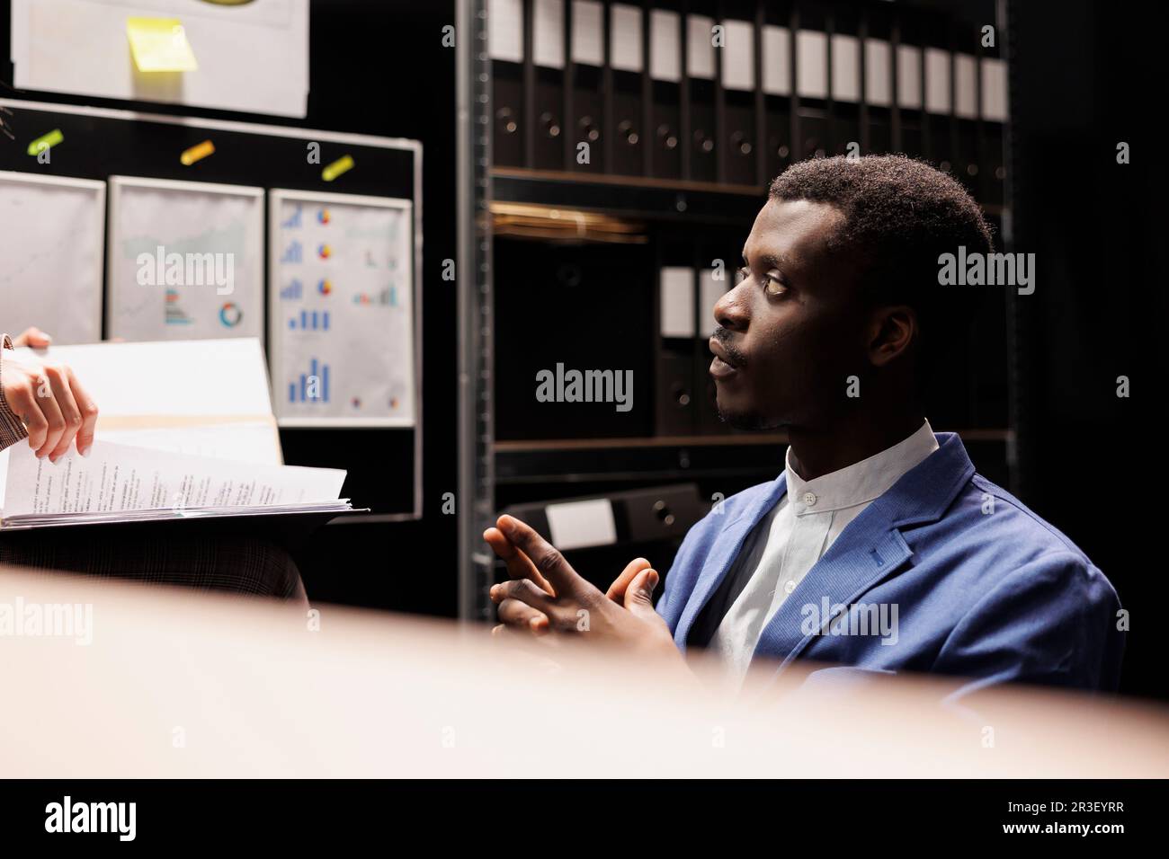 Officers discussing criminal case Stock Photo - Alamy