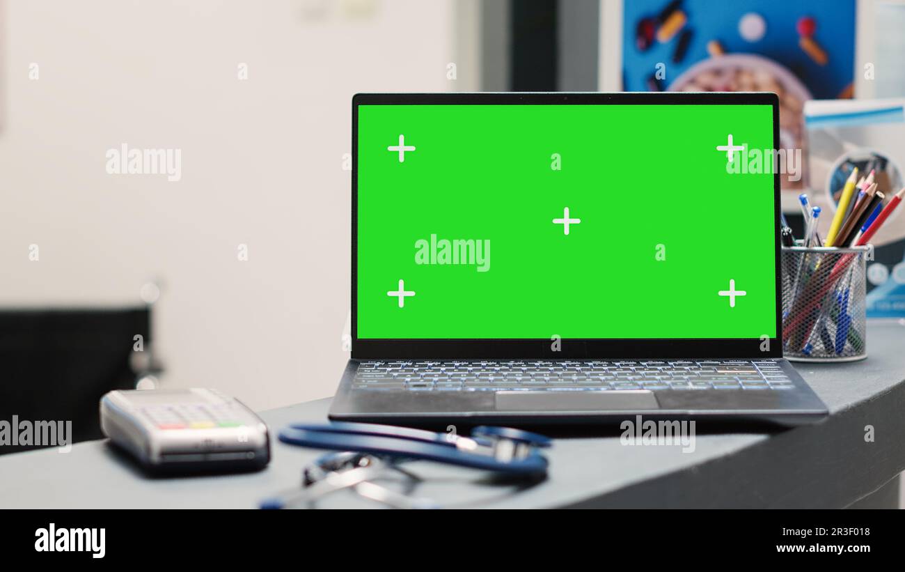 Empty front desk with green screen on pc Stock Photo - Alamy