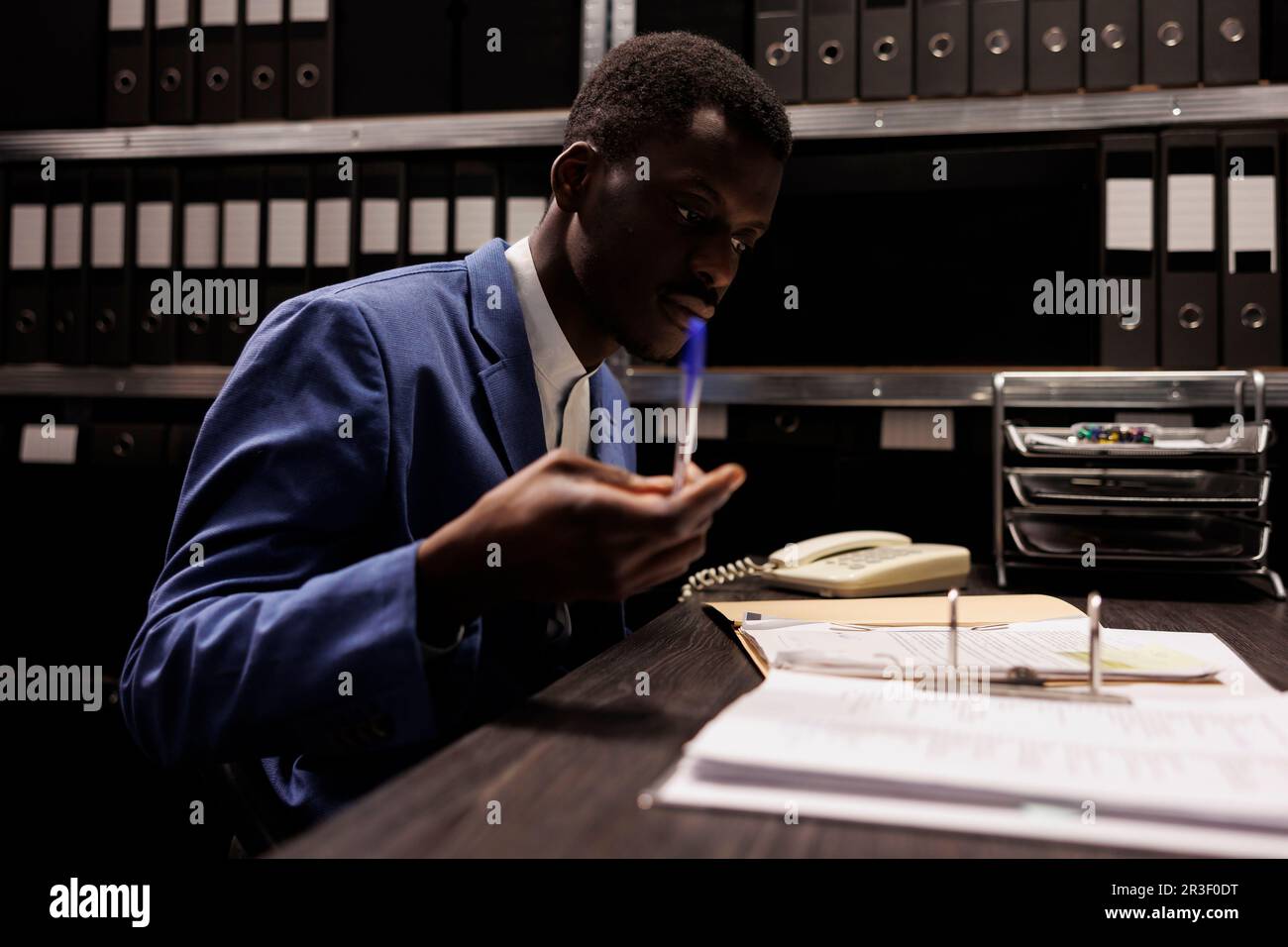 Manager checking administrative files Stock Photo - Alamy
